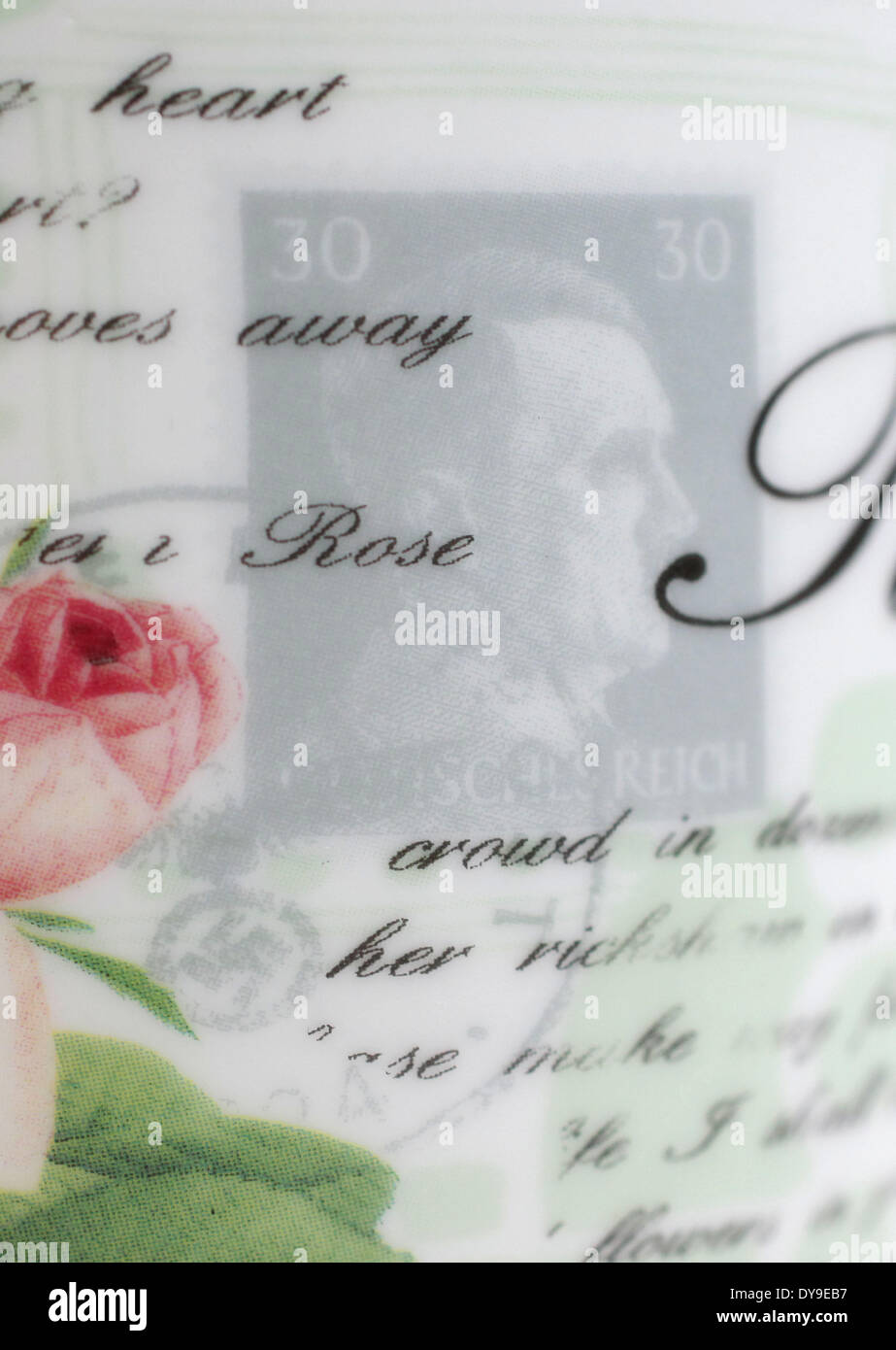 A mug with a print of a faded stamp with a portrait of Nazi dictator ...