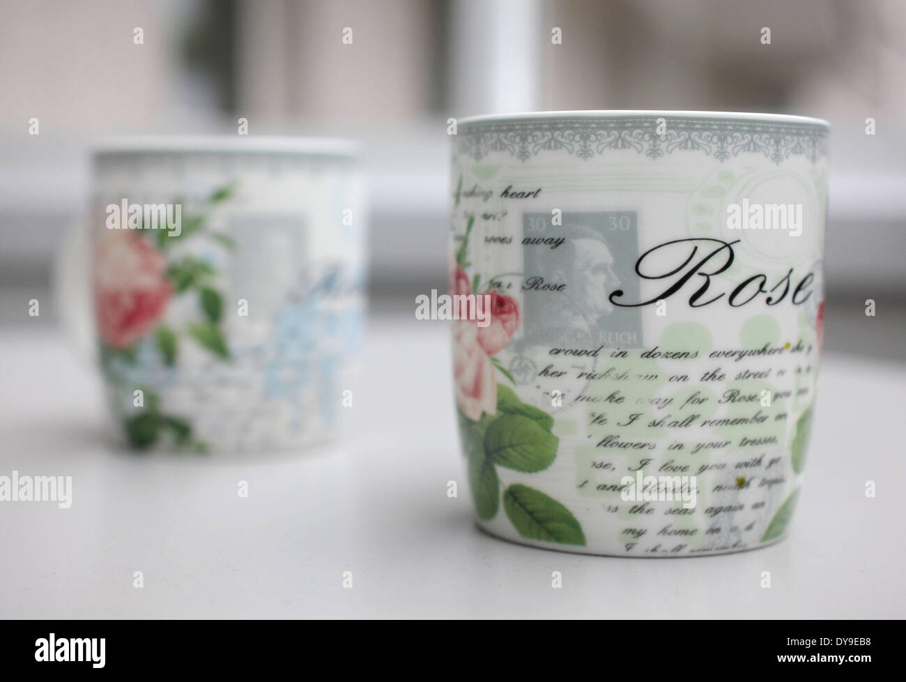 A mug with a print of a faded stamp with a portrait of Nazi dictator ...