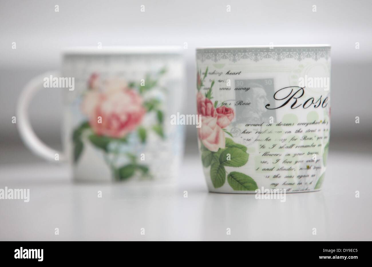 Two mugs with a print of a faded stamp with a portrait of Nazi dictator ...