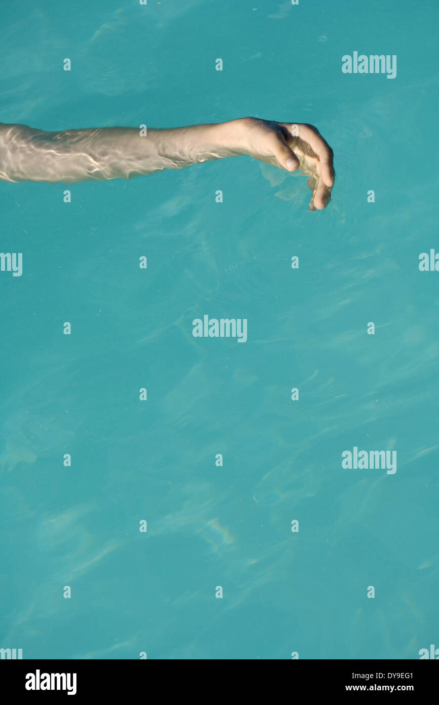 Woman's arm floating in pool Stock Photo - Alamy