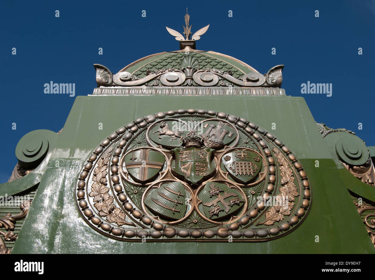 crest on hammersmith bridge, crossing the river thames in west london ...