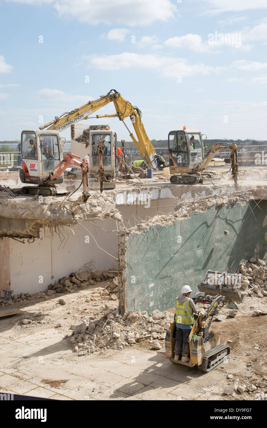 Demolition machines demolishing shops in Corby Town Centre ...