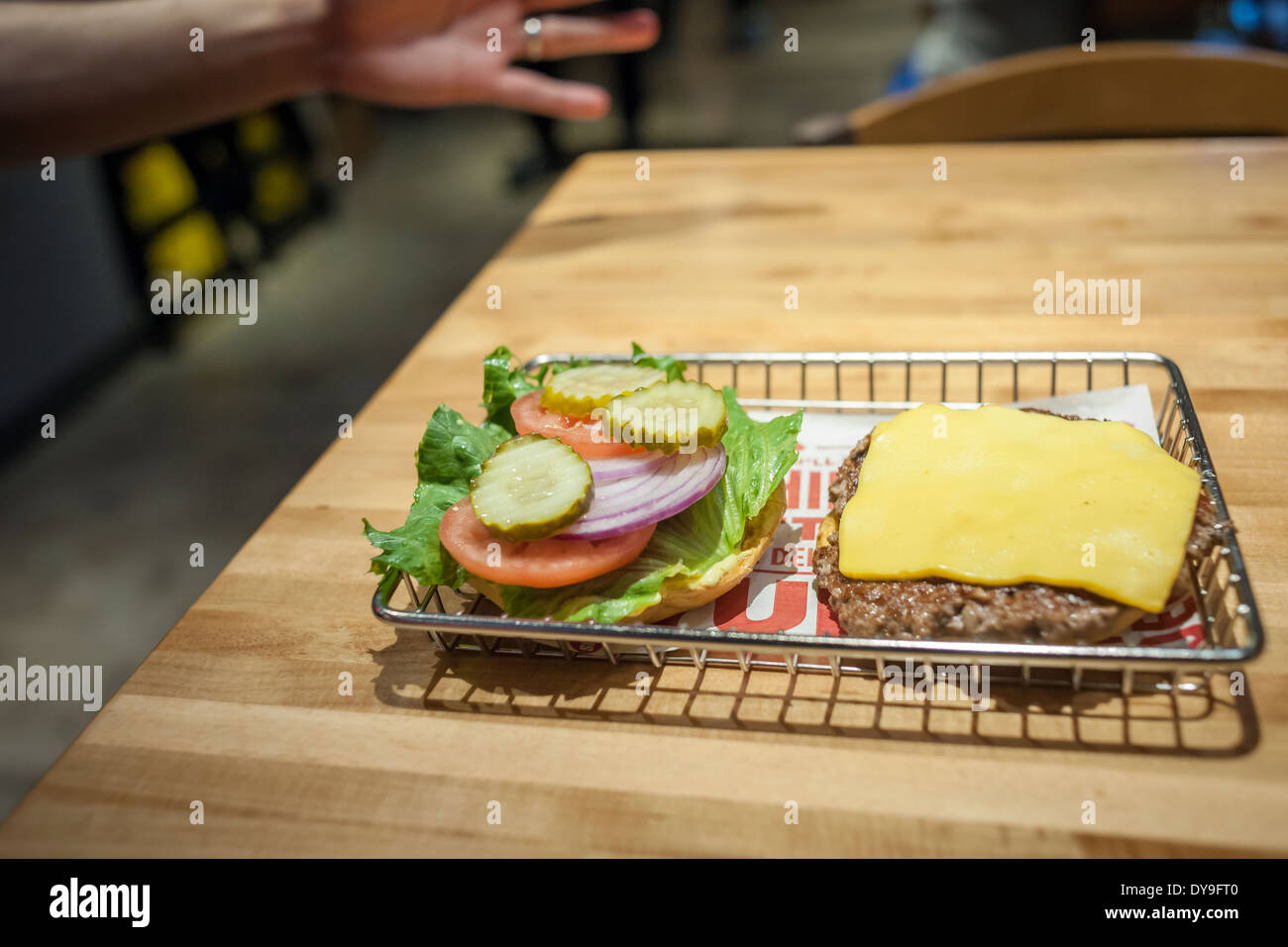 Server delivers order at the new Smashburger restaurant in New York ...