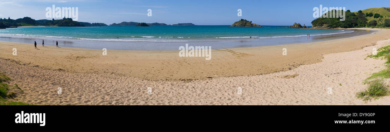 Panoramic view of Te Ngaere Bay and its islets in the background ...
