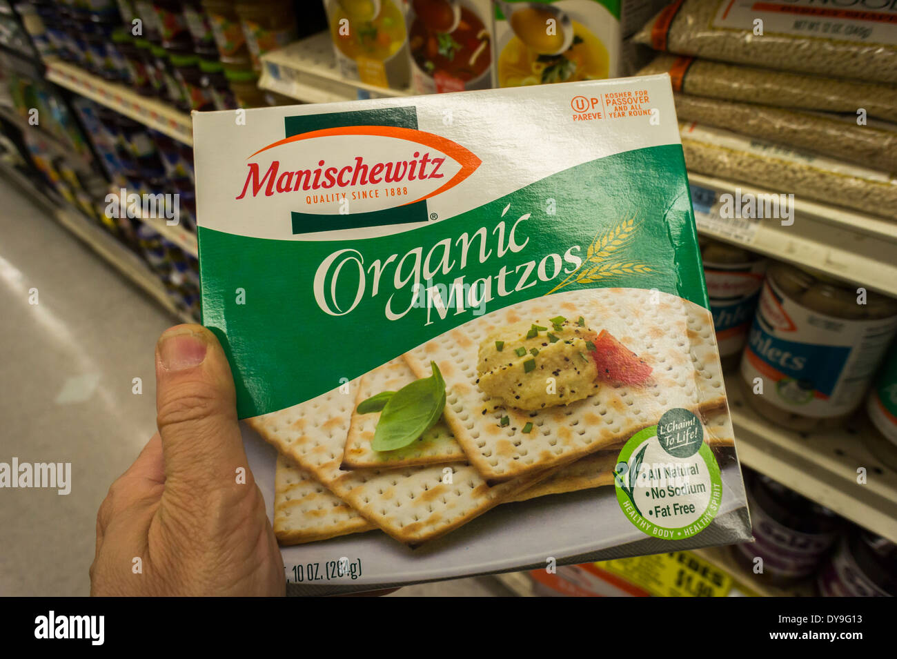 A customer chooses a box of Manischewitz organic matzos in the Kosher ...