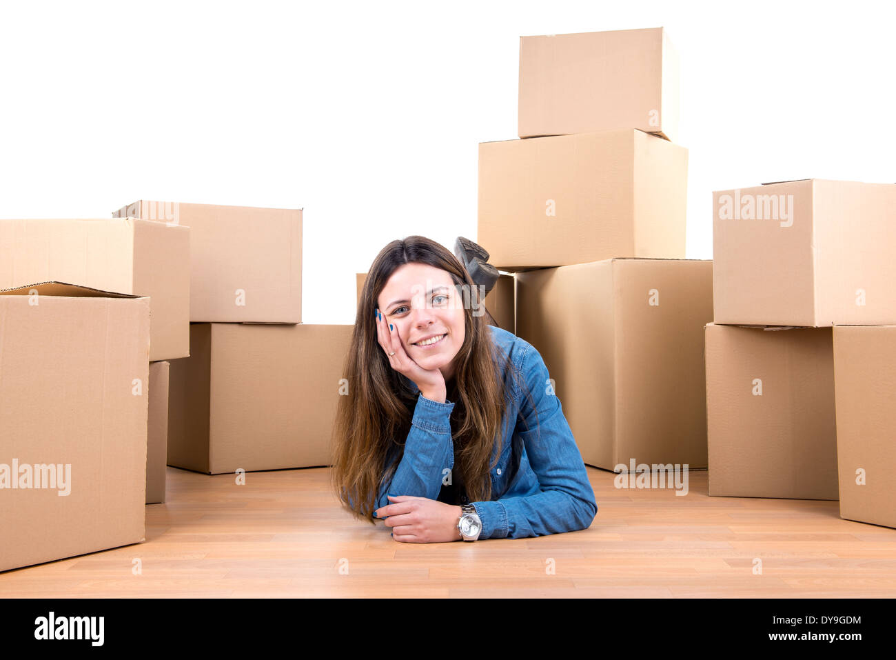 Beautiful girl with cardboard boxes unpacking in new home Stock Photo ...