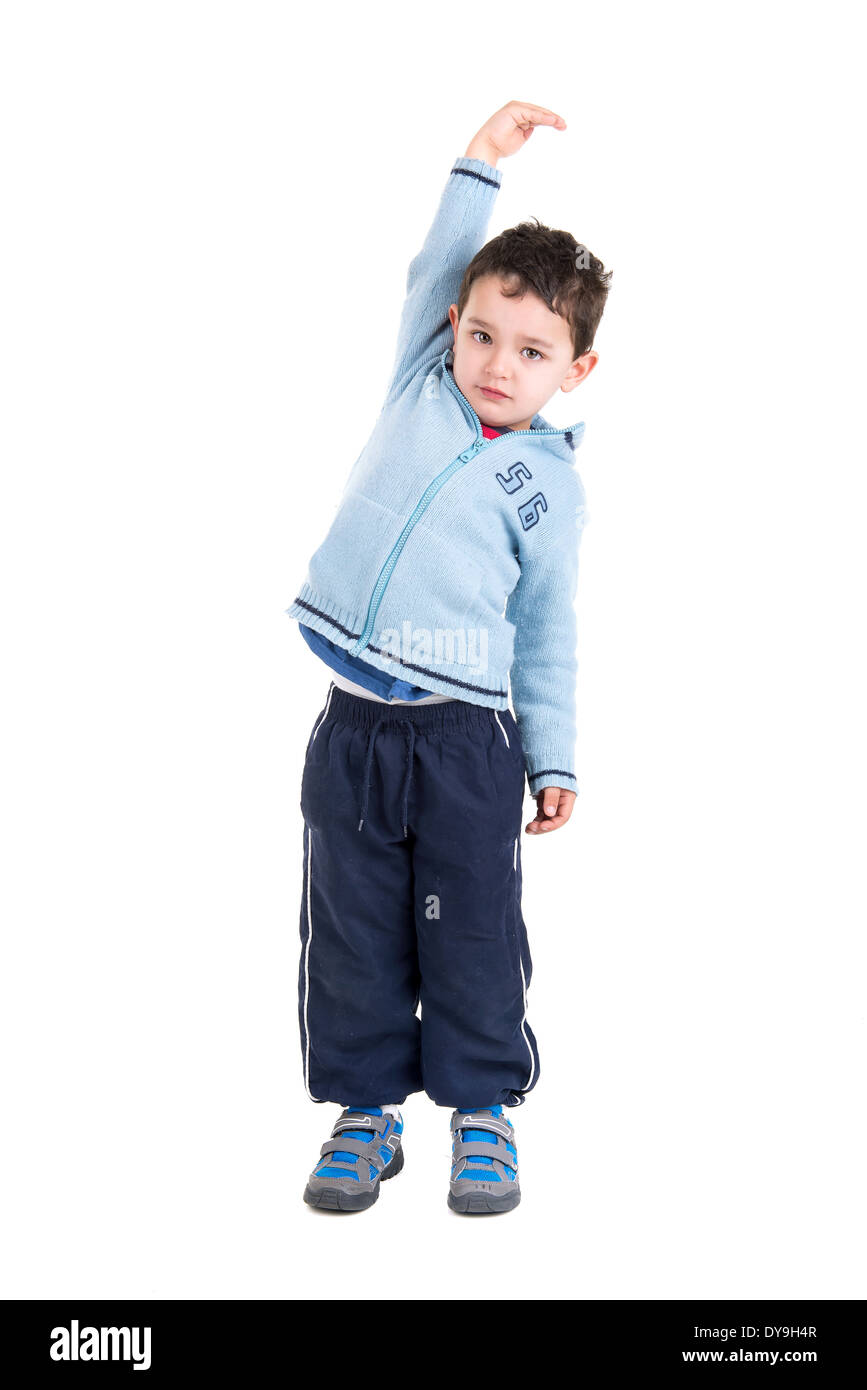 Young boy measuring his hight isolated in white Stock Photo - Alamy