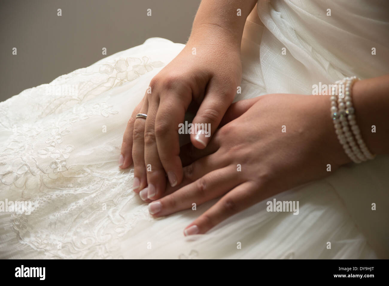 Hands resting on his lap notion Stock Photo - Alamy