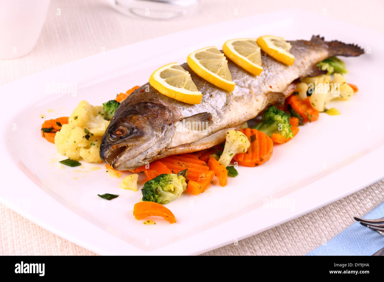 Grilled whole trout, vegetables and lemon, top view Stock Photo - Alamy