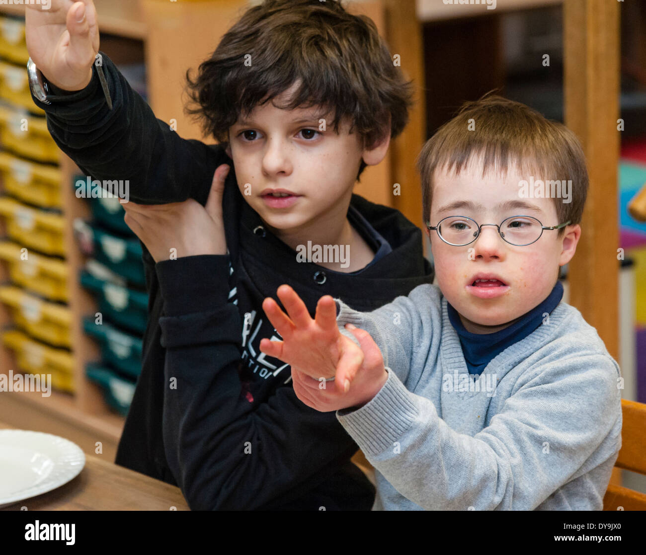 Non-disabled and disabled pupils (in this case a boy suffering from ...