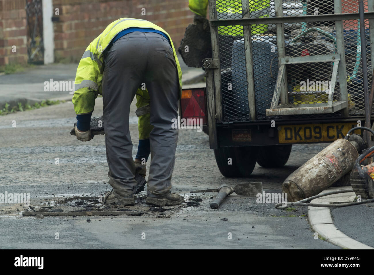 Council workers repairing potholes. UK Stock Photo - Alamy