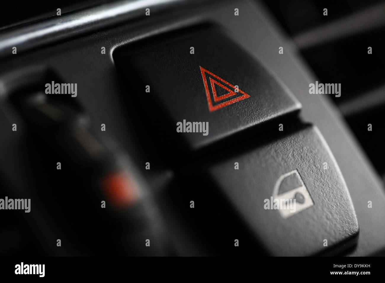 Detail of a warning button in a car Stock Photo - Alamy