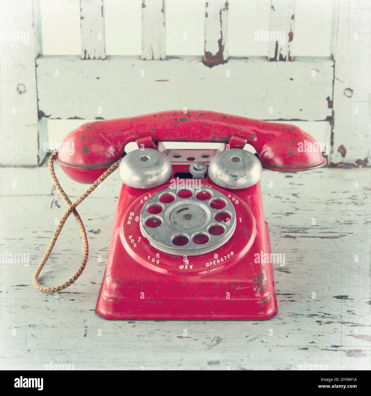 Red toy telephone on light blue wooden vintage chair Stock Photo - Alamy