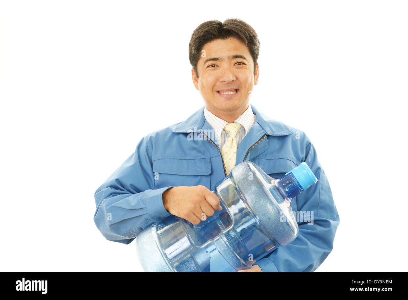 Worker with a container of water Stock Photo - Alamy
