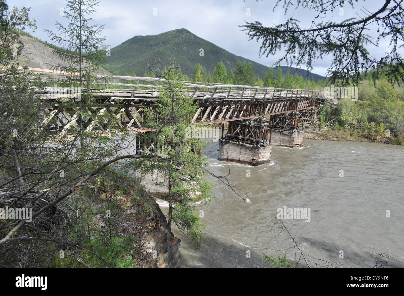 The bridge over the mountain river Suntar in Yakutia, Russia Stock ...