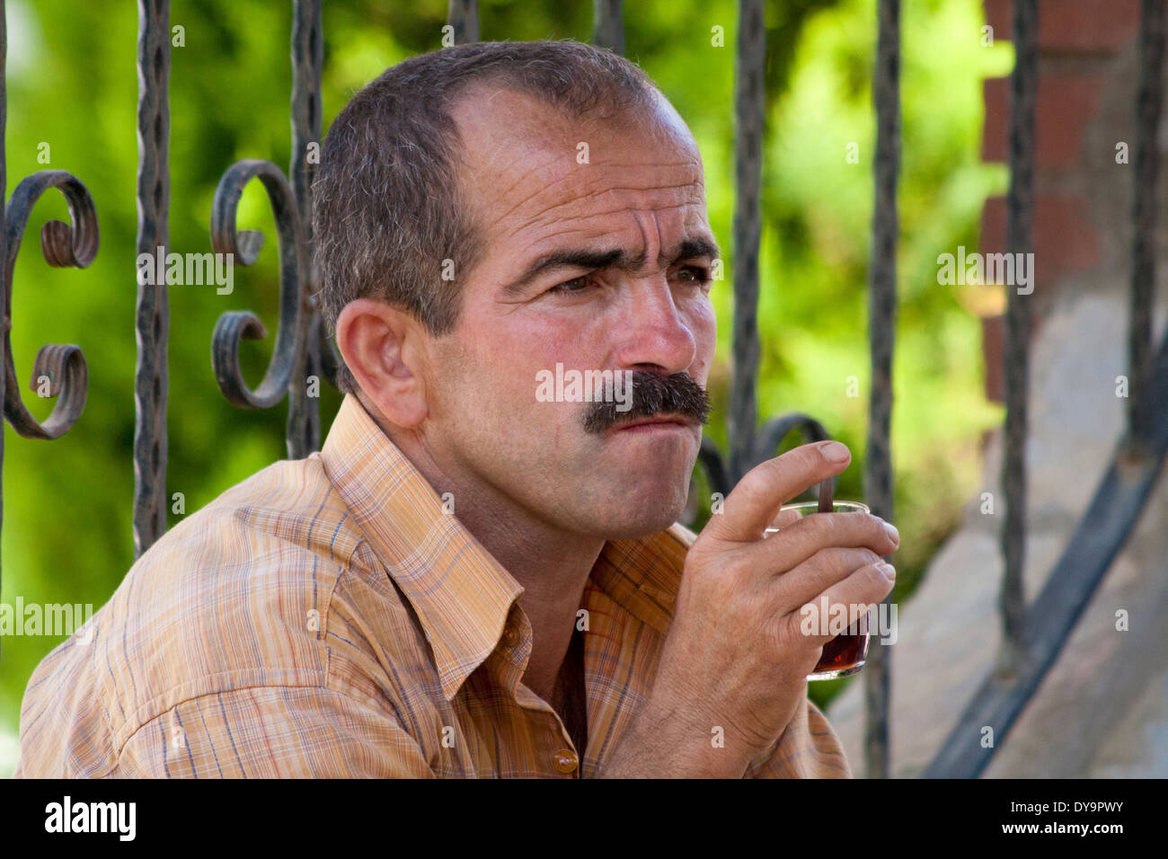 A Turkish man drinking tea, Alanya, Turkey Stock Photo - Alamy