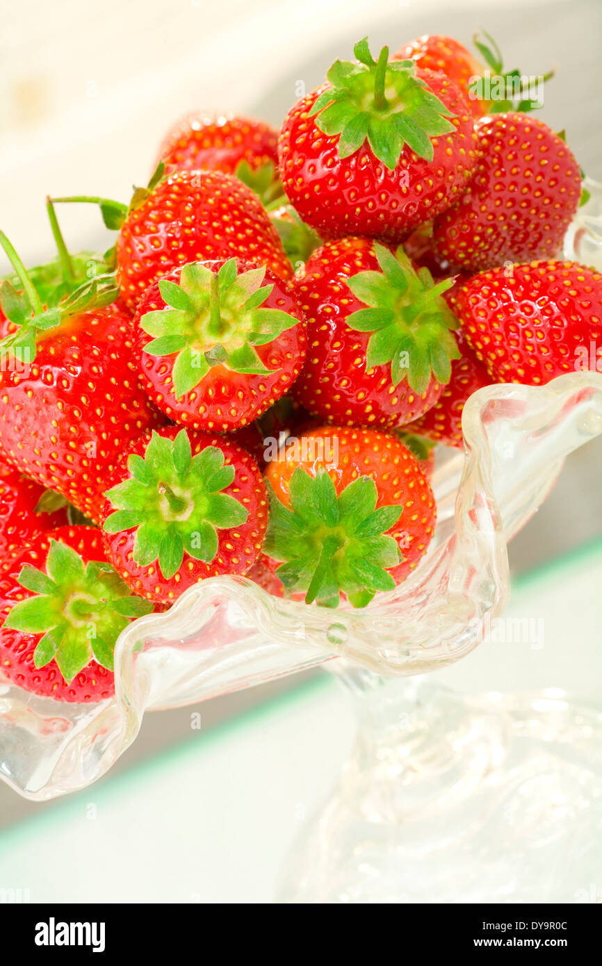 High key photo of fruit dish filled with nice red strawberries Stock ...