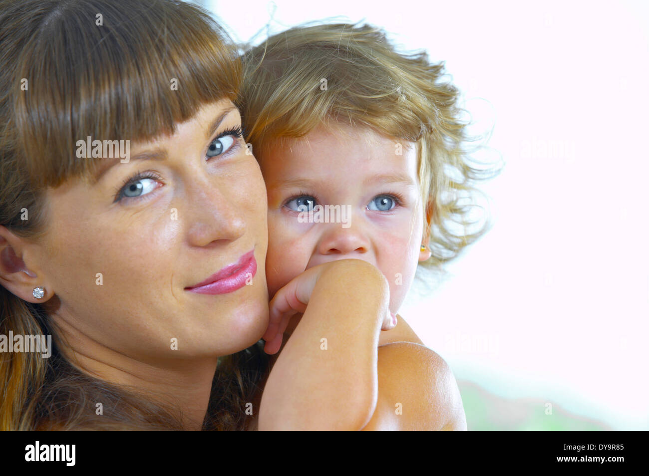 High key portrait of happy mother with baby Stock Photo - Alamy