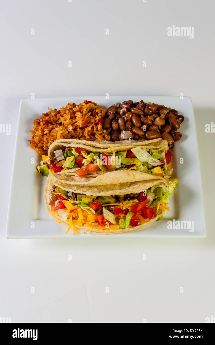 Two Tacos beans and rice with all the ingredients Stock Photo - Alamy