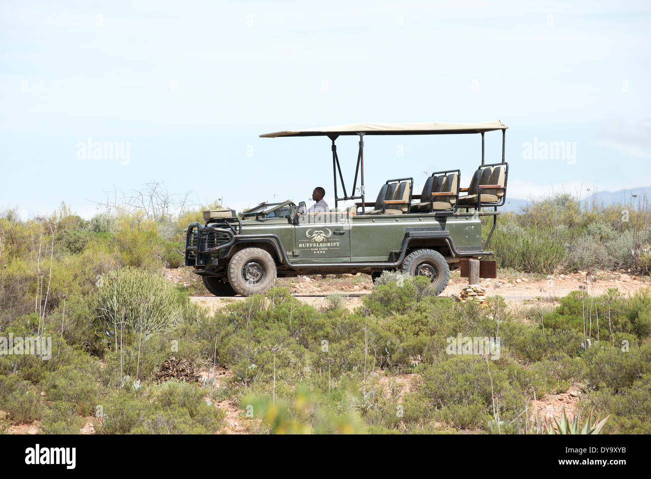 Game drive vehicle and driver. Bufflesdrift Game Park Oudsthoorn South ...