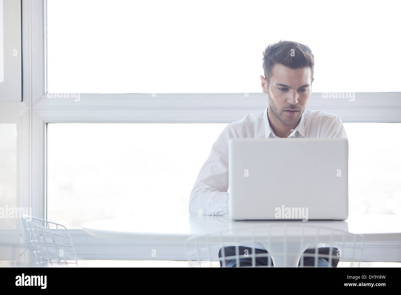 Man using laptop computer Stock Photo - Alamy