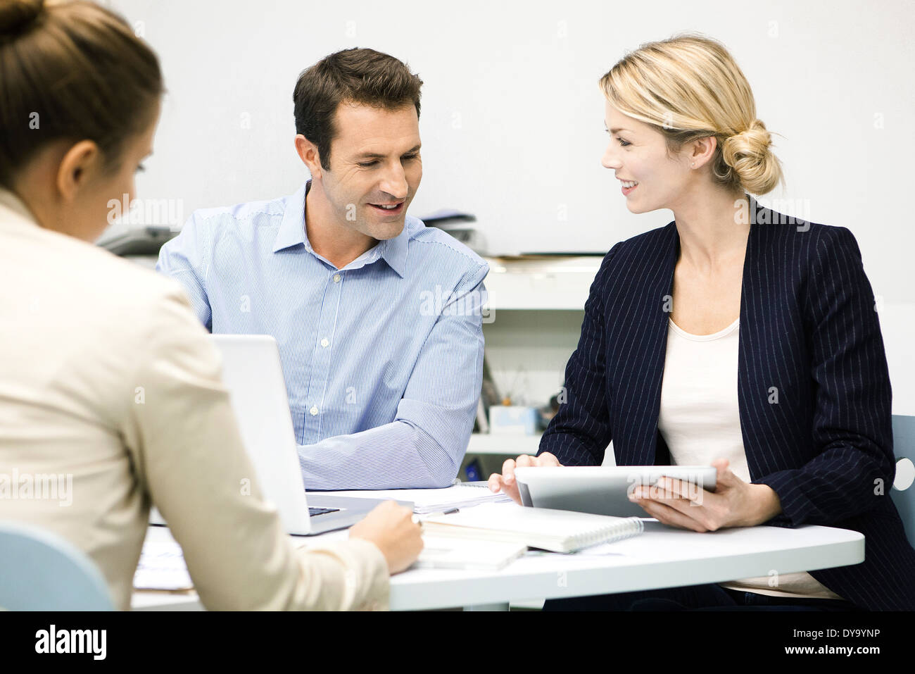 Colleagues working together Stock Photo - Alamy