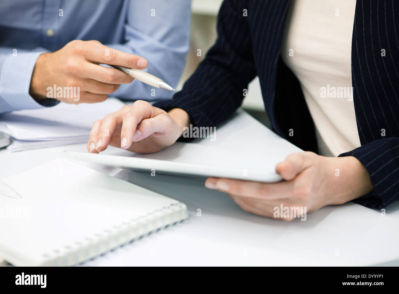 Gesturing worker using tablet hi-res stock photography and images - Alamy