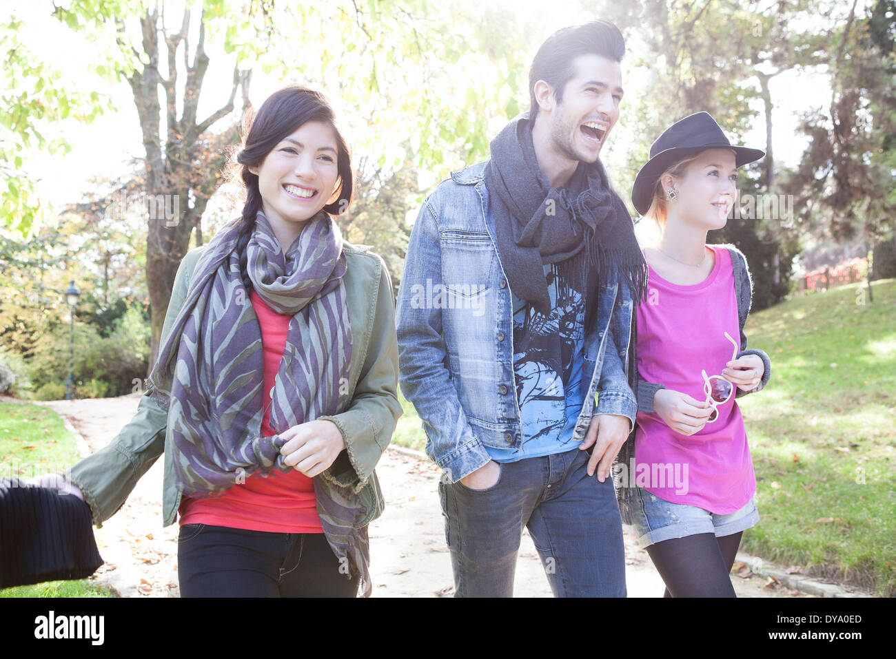 Male traveler walking in park hi-res stock photography and images - Alamy