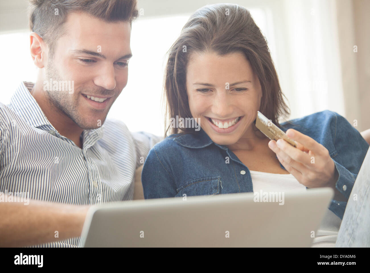 Couple at home shopping online together Stock Photo - Alamy