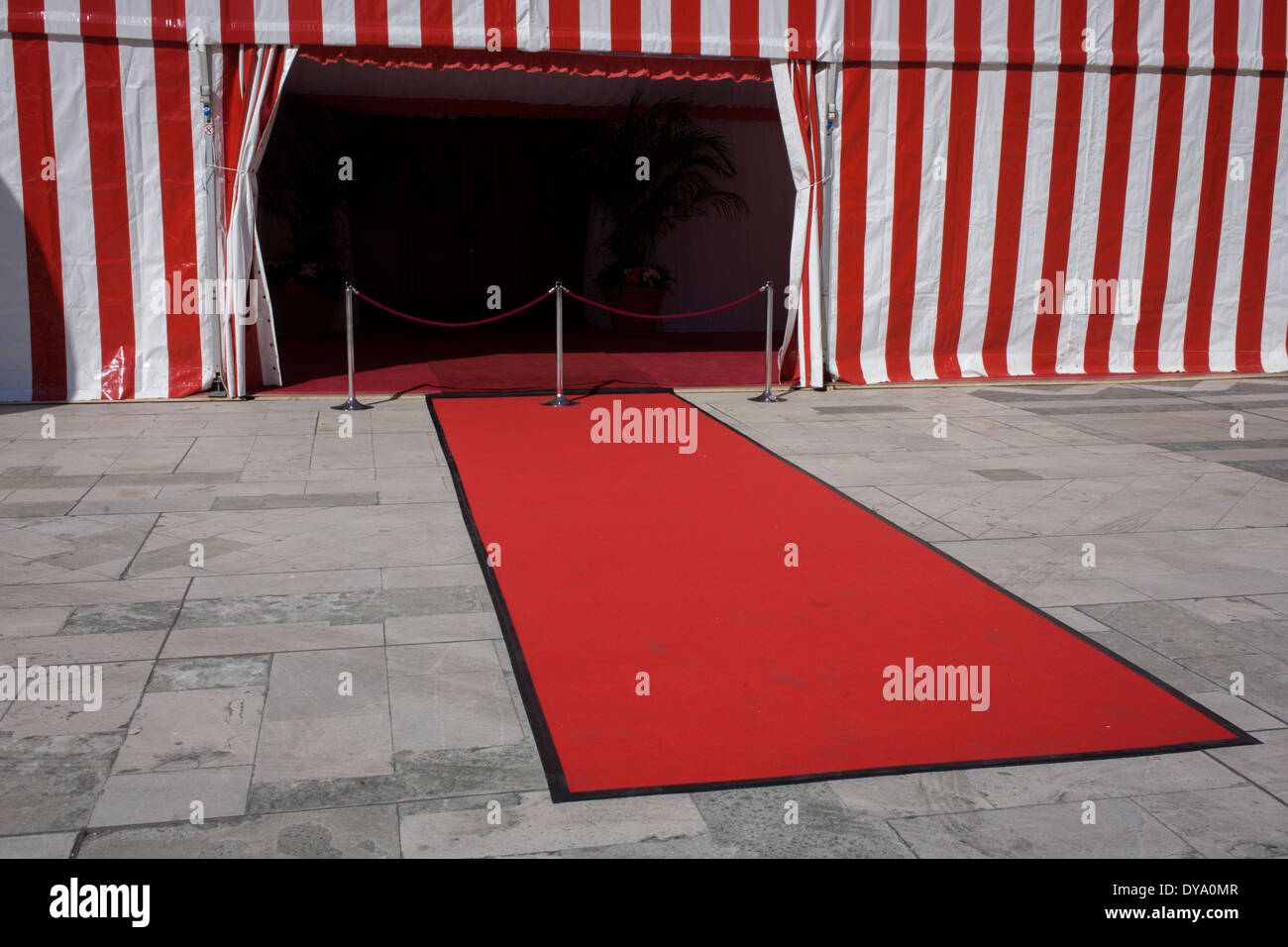 A red carpet and red and white striped marquee is seen after a military ...