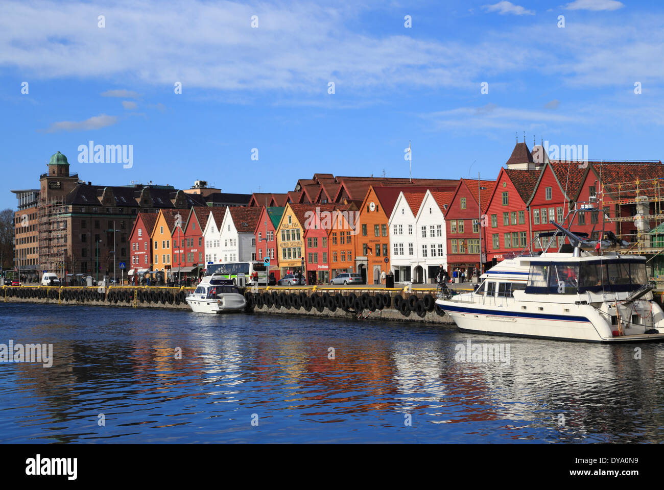 Boats dock alongside The UNESCO World Heritage Site, Bryggen, in Bergen ...