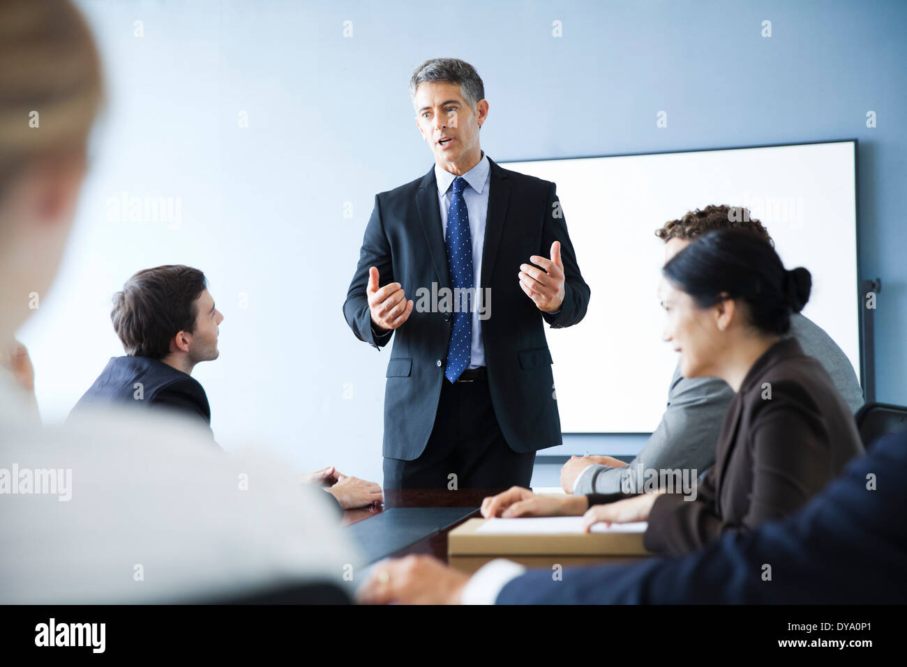 Corporate trainer leading training session Stock Photo - Alamy
