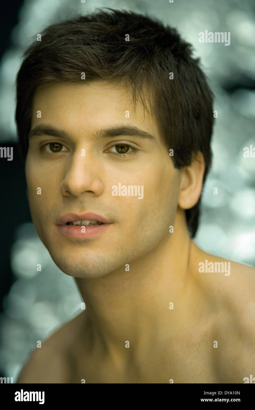 Young man looking at camera, portrait Stock Photo - Alamy