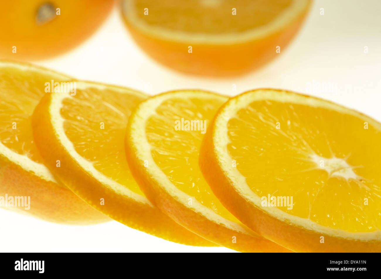 Pieces of nice juicy sliced orange on white sheet Stock Photo - Alamy