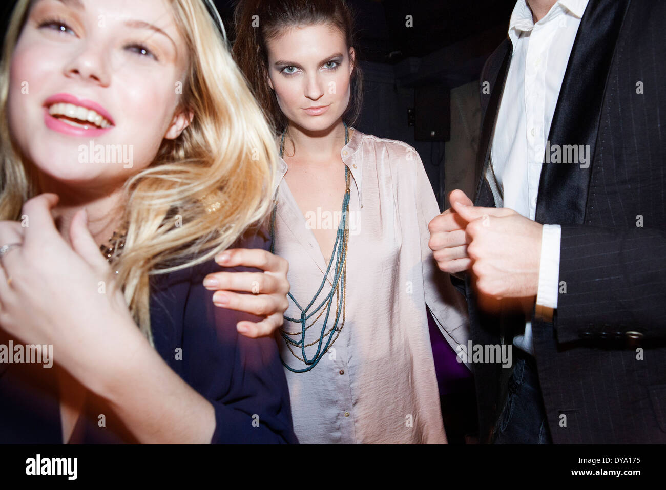 Friends out at night having fun Stock Photo - Alamy