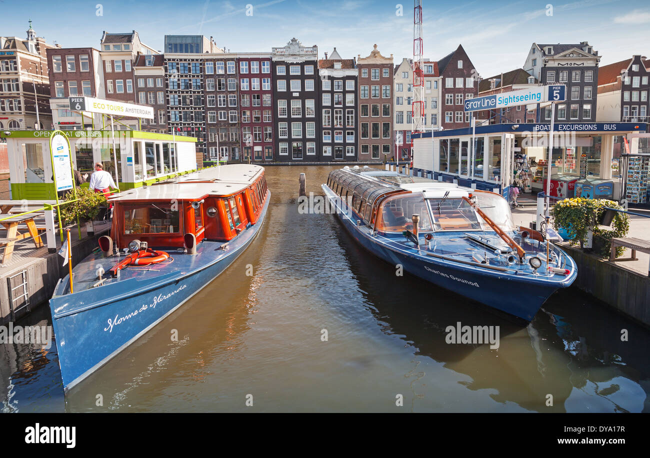 AMSTERDAM, NETHERLANDS - MARCH 19, 2014: Colorful Pleasure boats stand ...