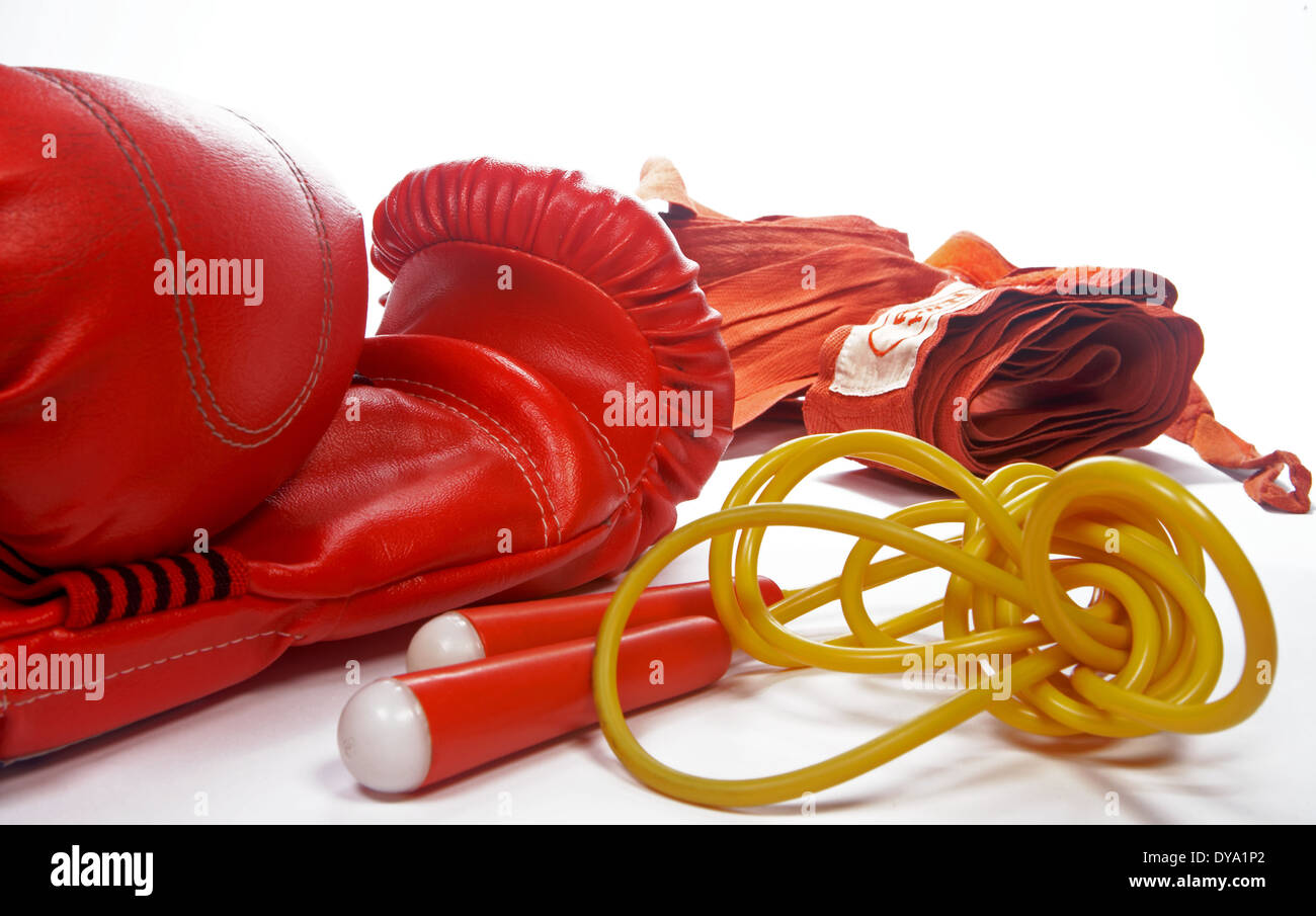 view of boxer’s accessories waiting for their owner on white sheet ...