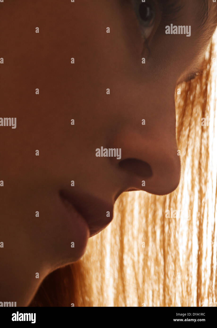 Woman's face and straight hair in background, side view Stock Photo - Alamy