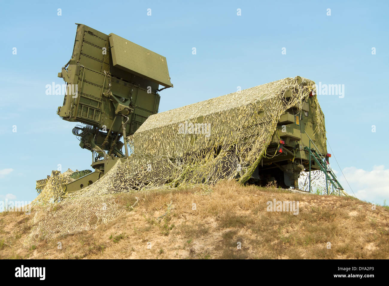 Mobile tactical air defense radar on position covered with a camouflage ...