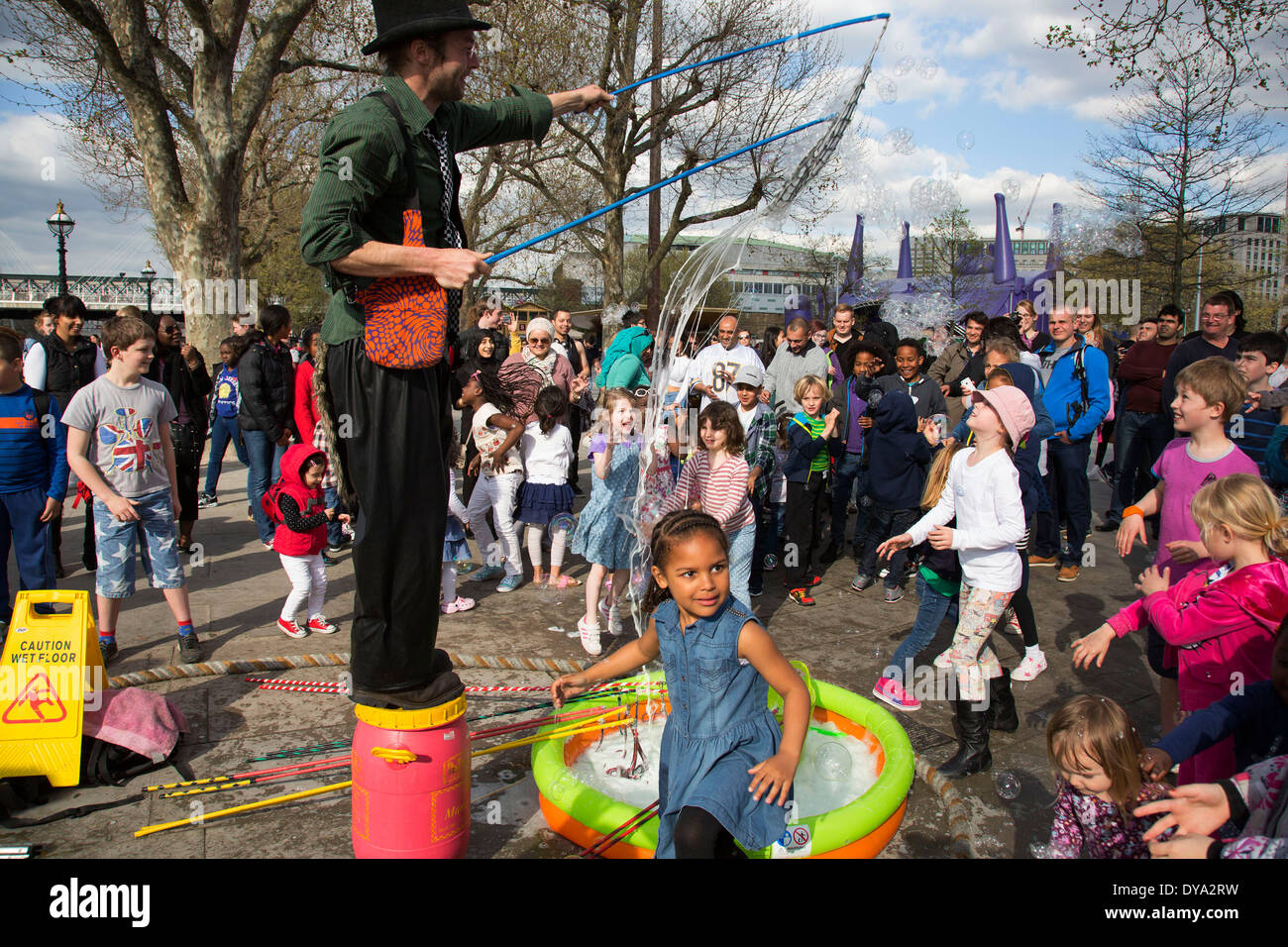 Bubble man on the South Bank walkway entertains children with his ...
