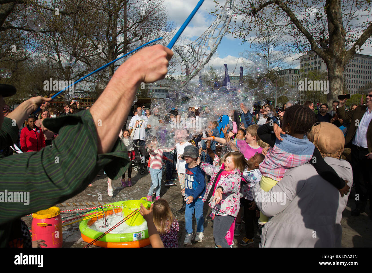 Bubble man on the South Bank walkway entertains children with his ...