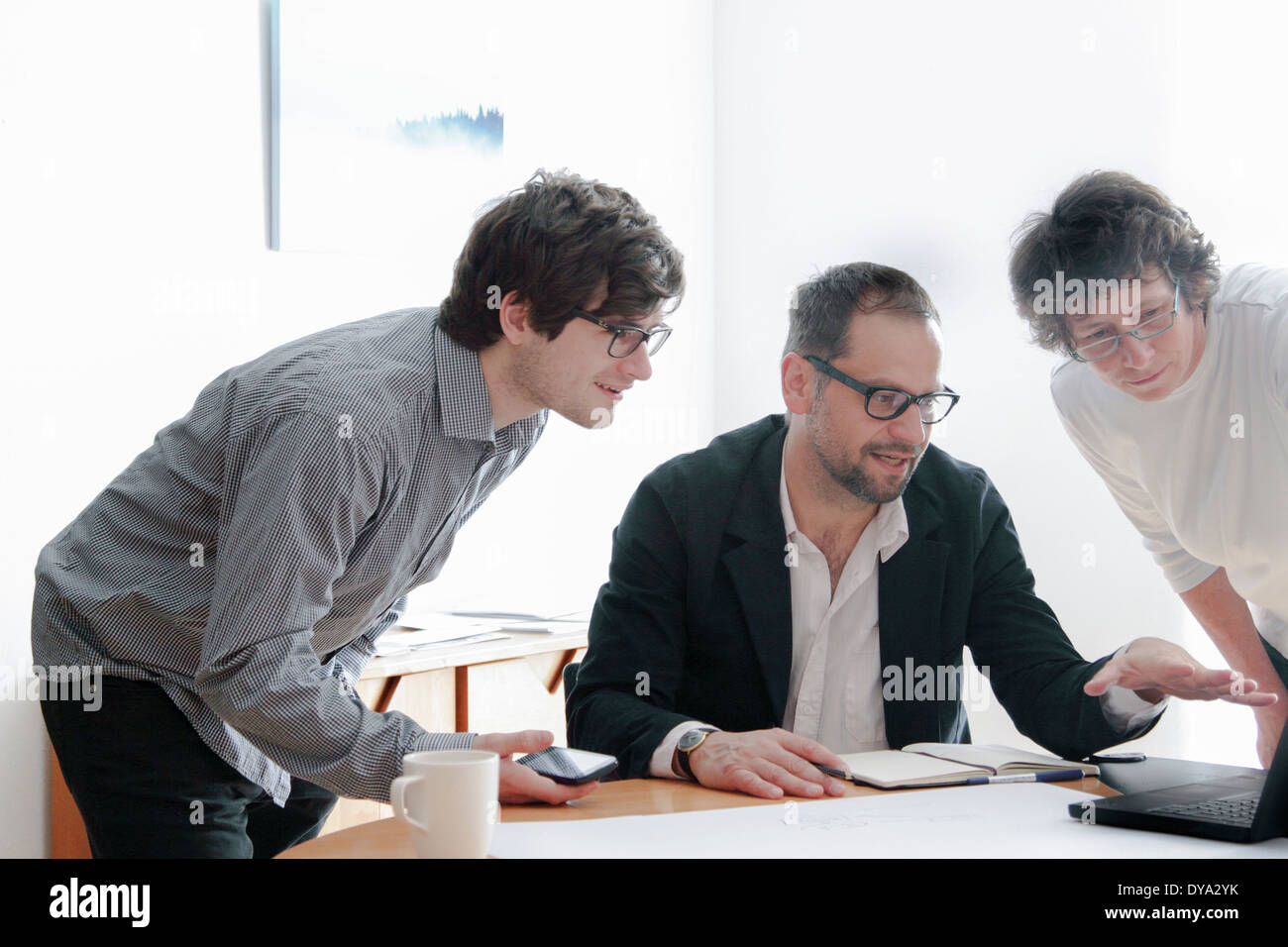 working together in a team teamwork business Stock Photo - Alamy