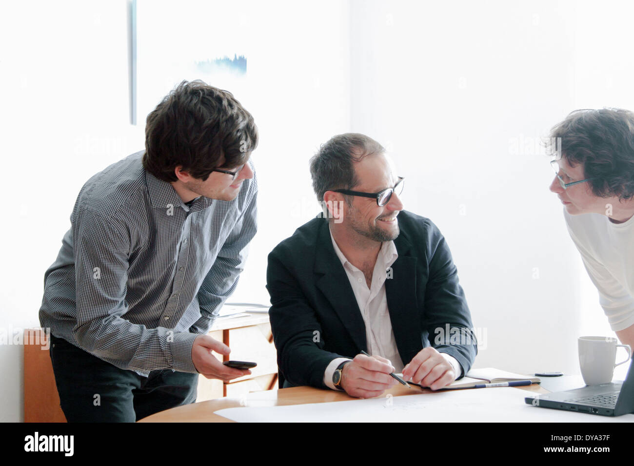 working together in a team teamwork business Stock Photo - Alamy