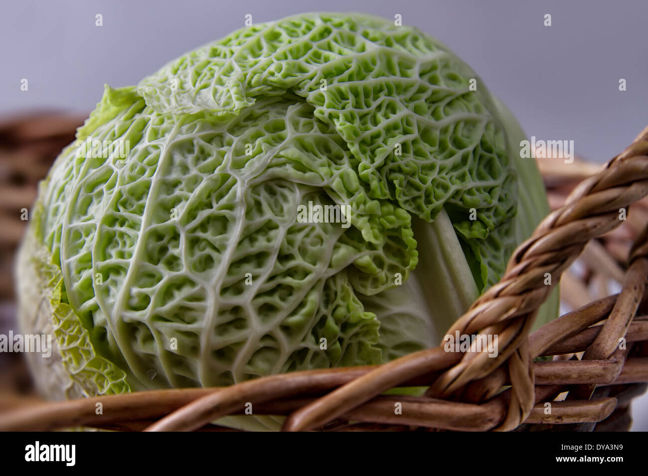 Cabbage in a wicker basket Stock Photo - Alamy