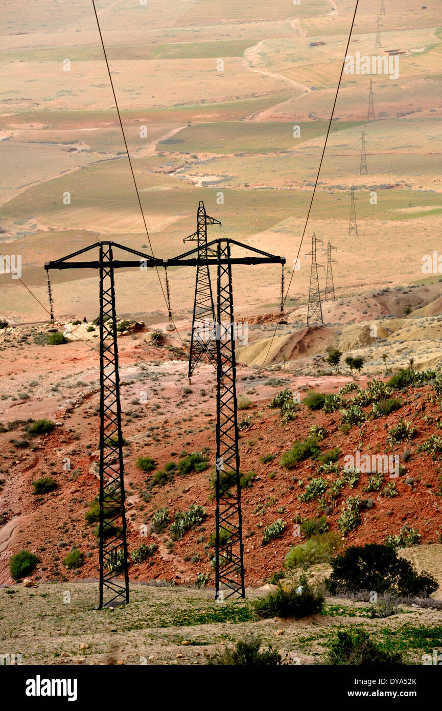High voltage power lines stretching across foothills of Atlas Mountains ...