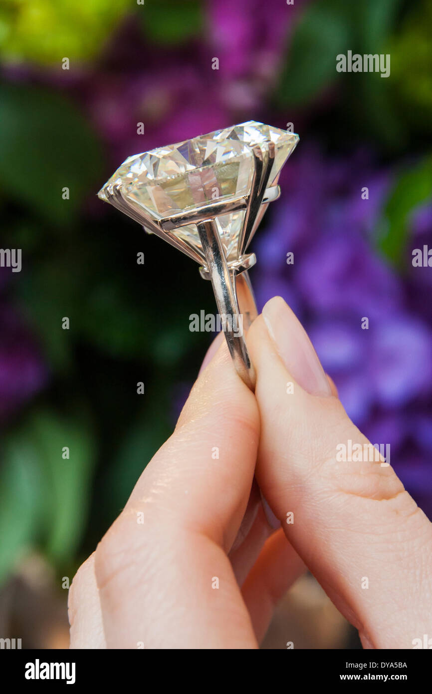 London, April 11th 2014. A woman at Sotheby's in London admires a round ...