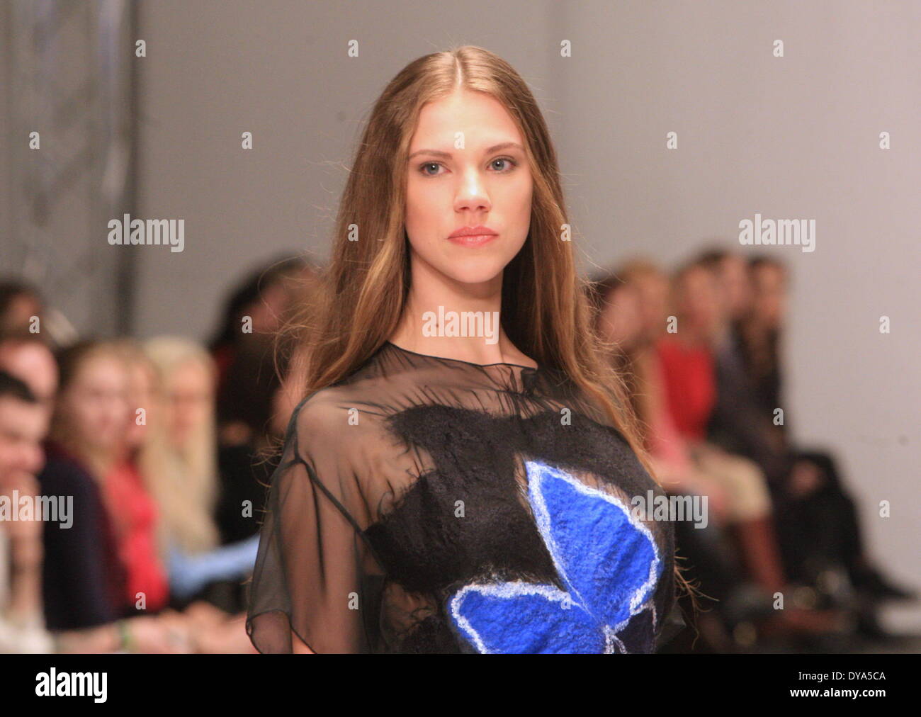 Minsk, Belarus. 11th Apr, 2014. A model presents a creation of ...