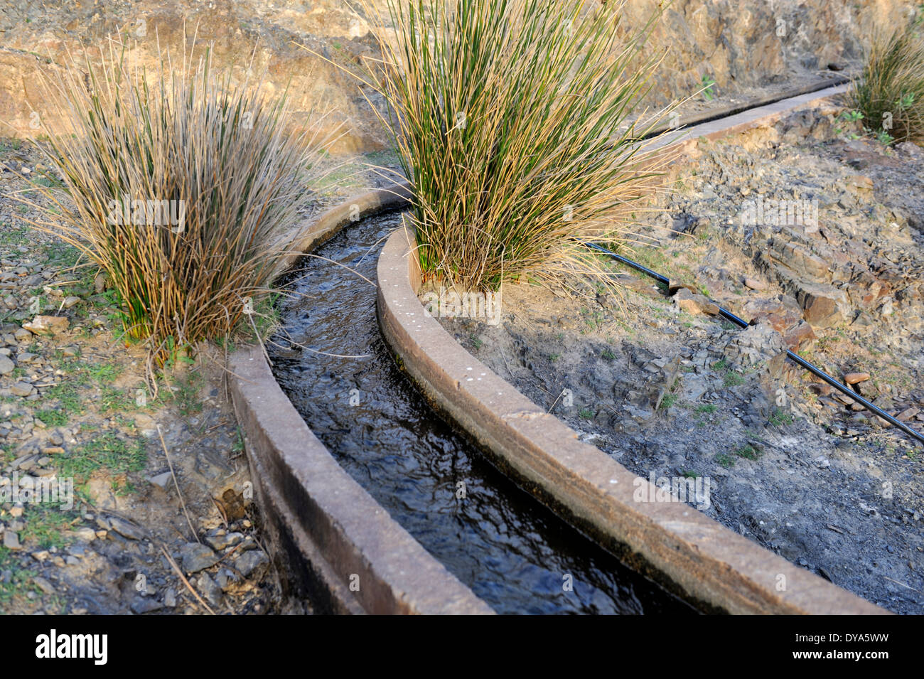 Small overground aqueduct with flowing water for irrigation, Morocco ...