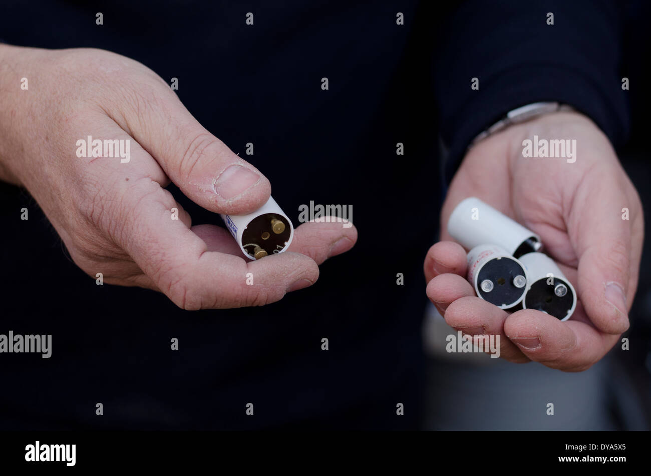 Hand of electrical holding fluorescent tube starters Stock Photo - Alamy