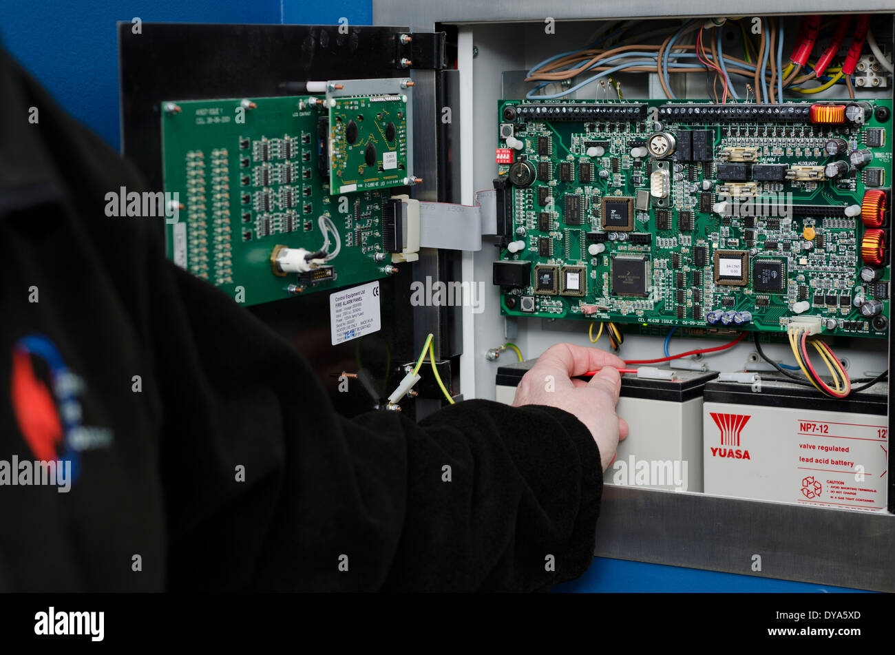 Engineer looking at circuit board Stock Photo - Alamy